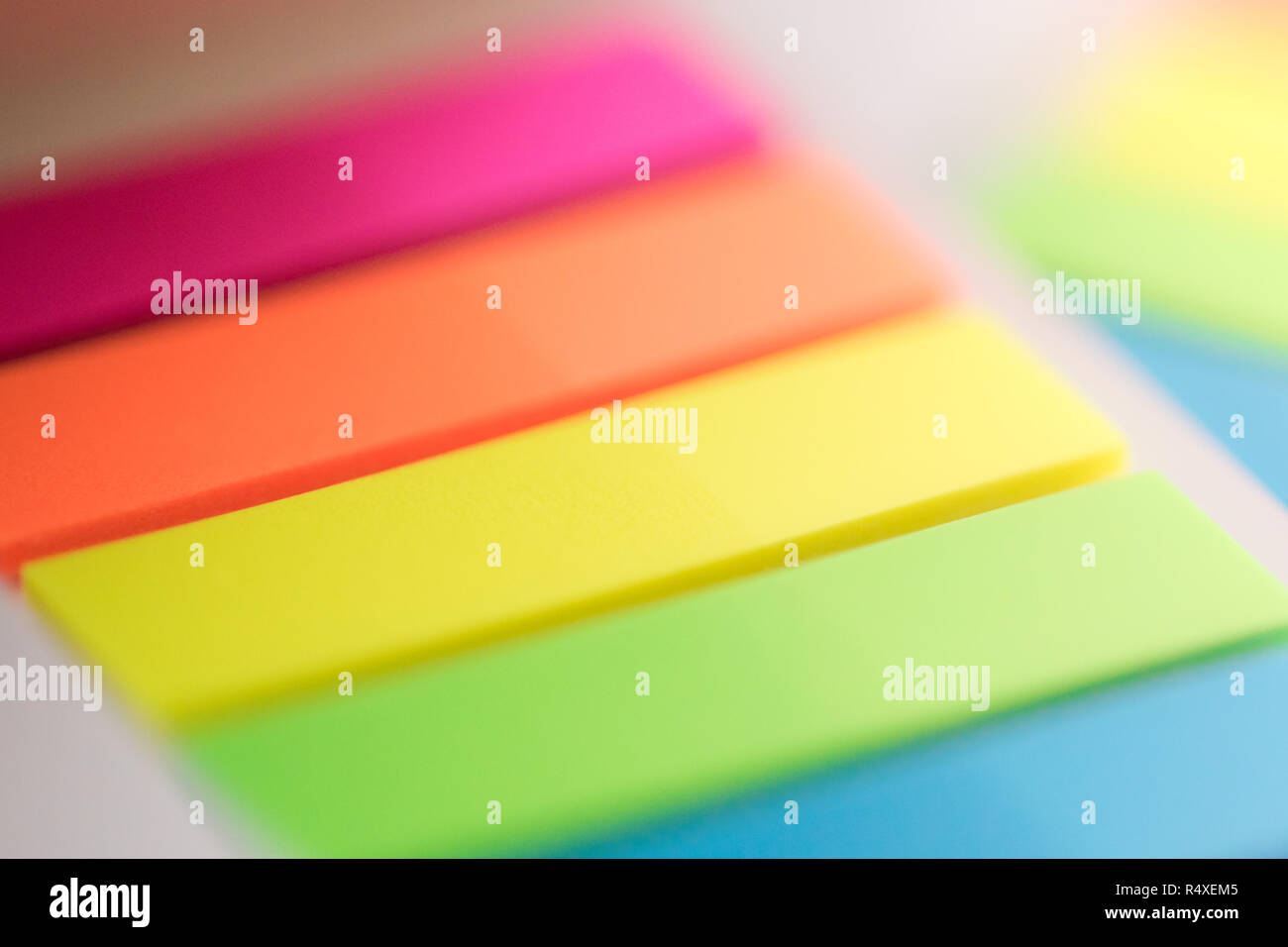 blurred background multicolored notes in a notebook with a white ...