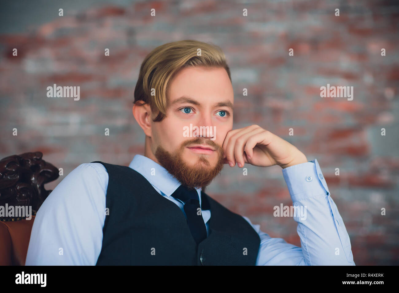 Portrait of blonde young man with uncommon appearance wears white t ...
