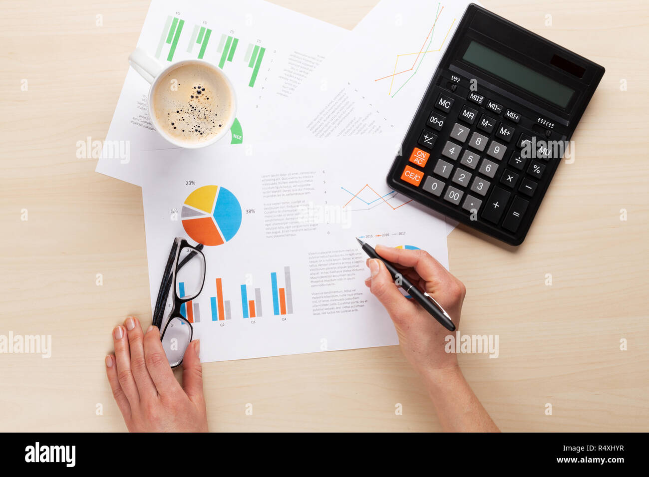 Woman working reports charts hi-res stock photography and images - Alamy