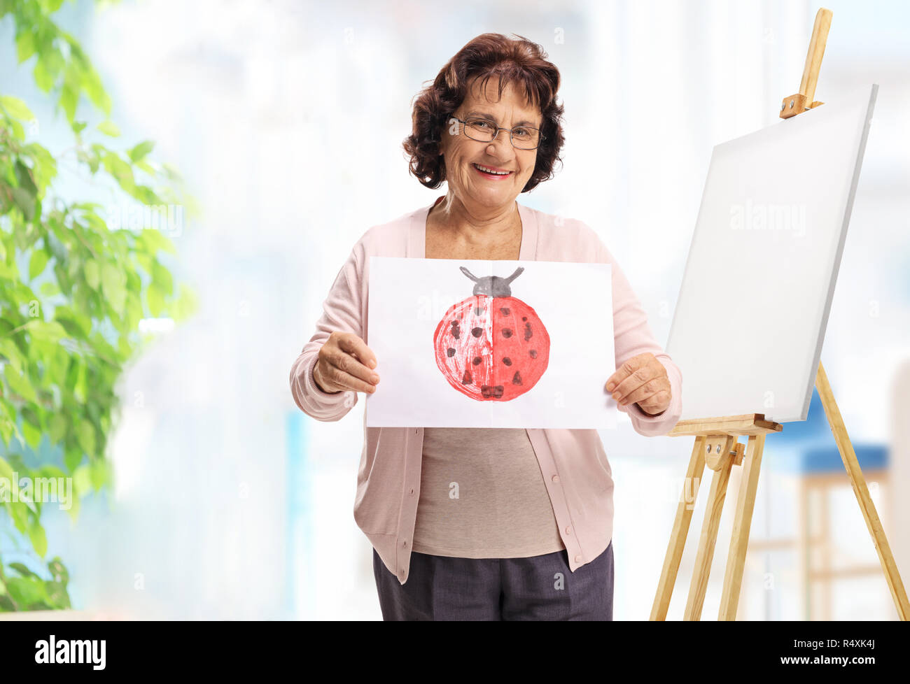 Old woman drawing hi-res stock photography and images - Alamy