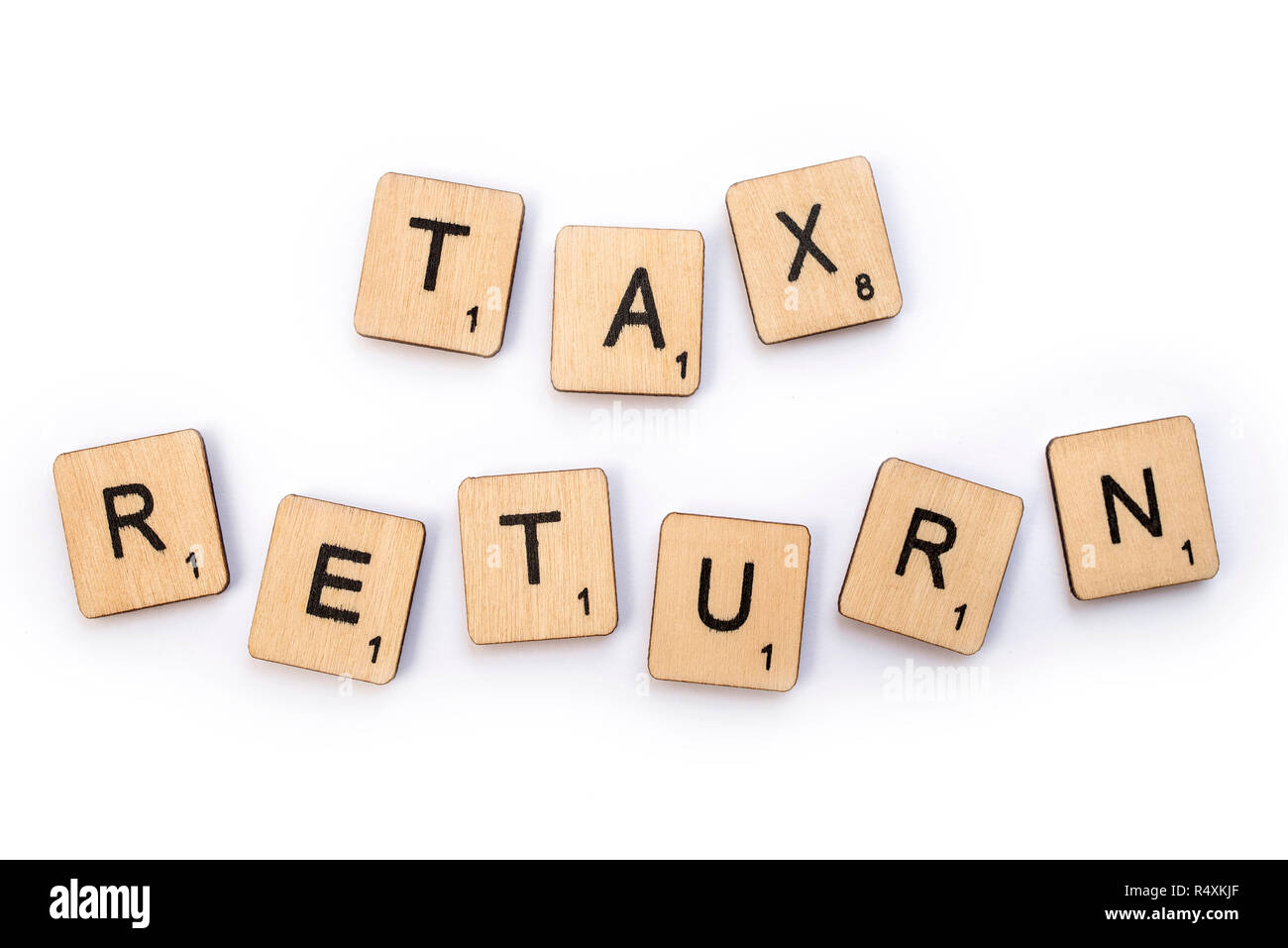 LONDON, UK - JULY 5TH 2018: TAX RETURN spelt with wooden letter ...