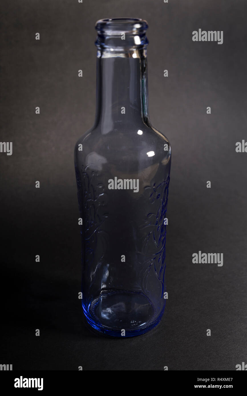 transparent blue empty water bottle on a black background Stock Photo ...
