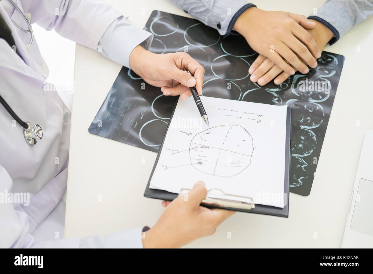 doctor giving a consultation discussing to patient and explaining ...