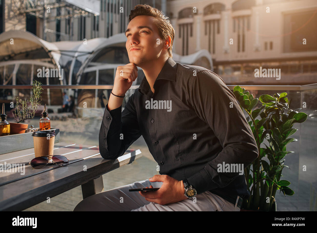 Young businessman looks paper hi-res stock photography and images - Alamy