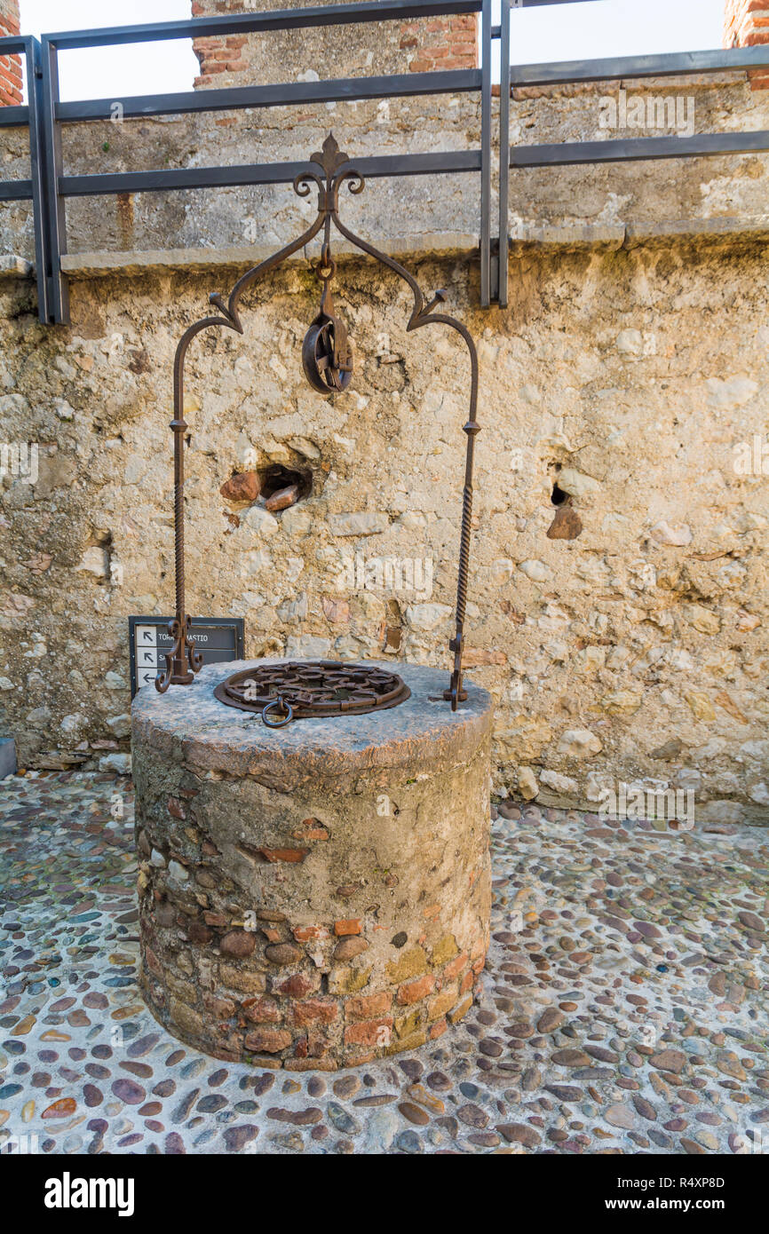 ancient medieval well in the Scaliger Castle of the medieval town ...