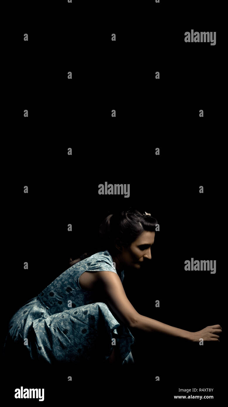 Woman crouched hi-res stock photography and images - Alamy