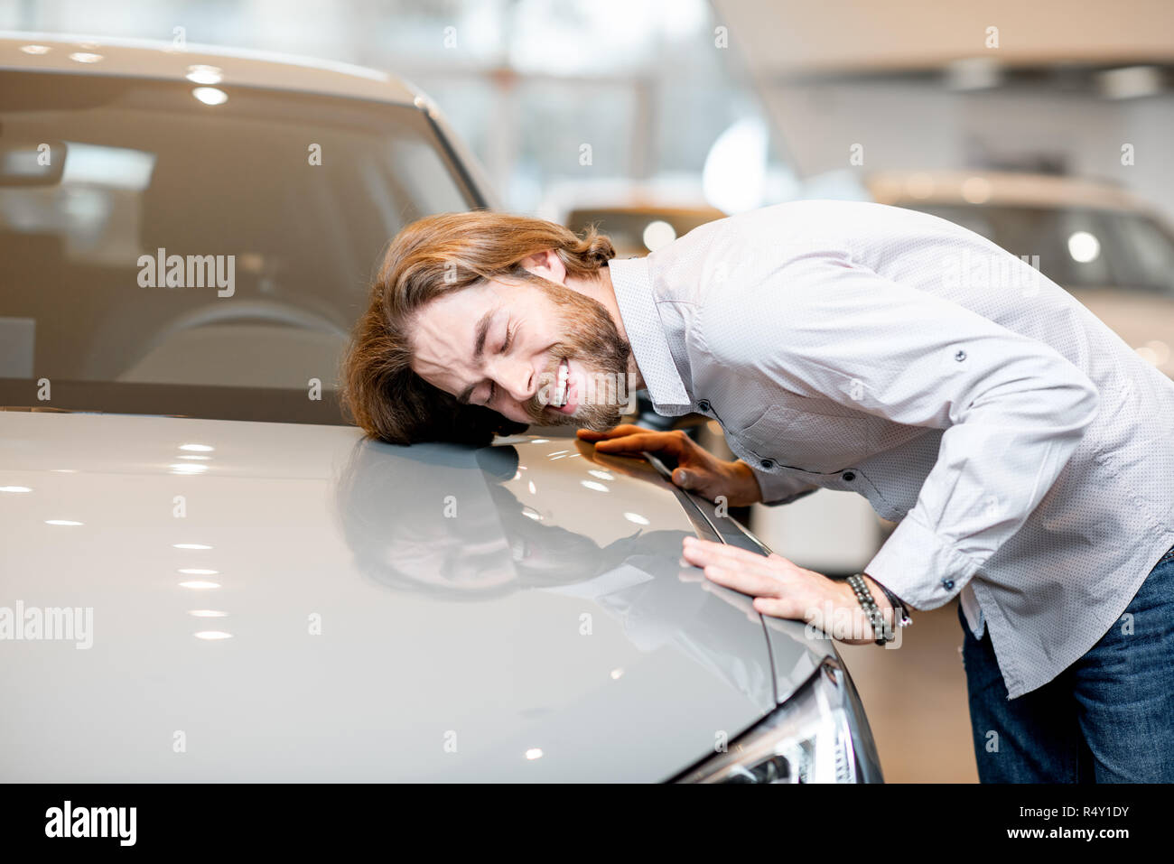 Customer hugging new cars hood hi-res stock photography and images - Alamy