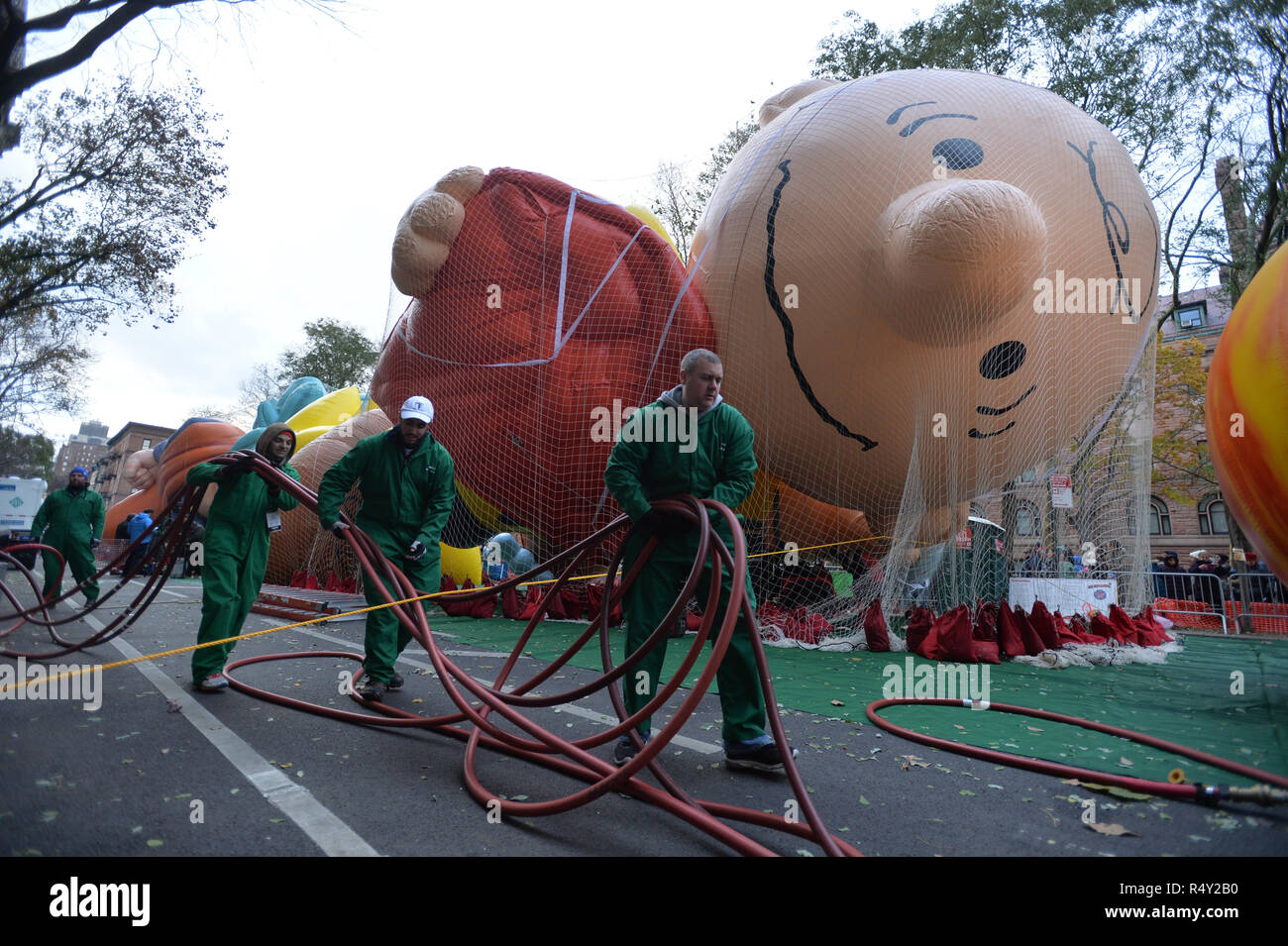 Workers are seen filling parade baloons with helium during the 92nd ...