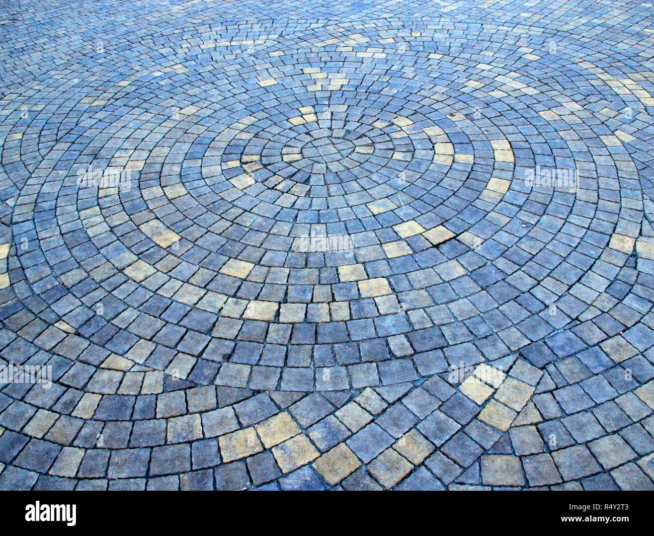 Cobblestone bridge made from figured stones on city road. Stony texture ...