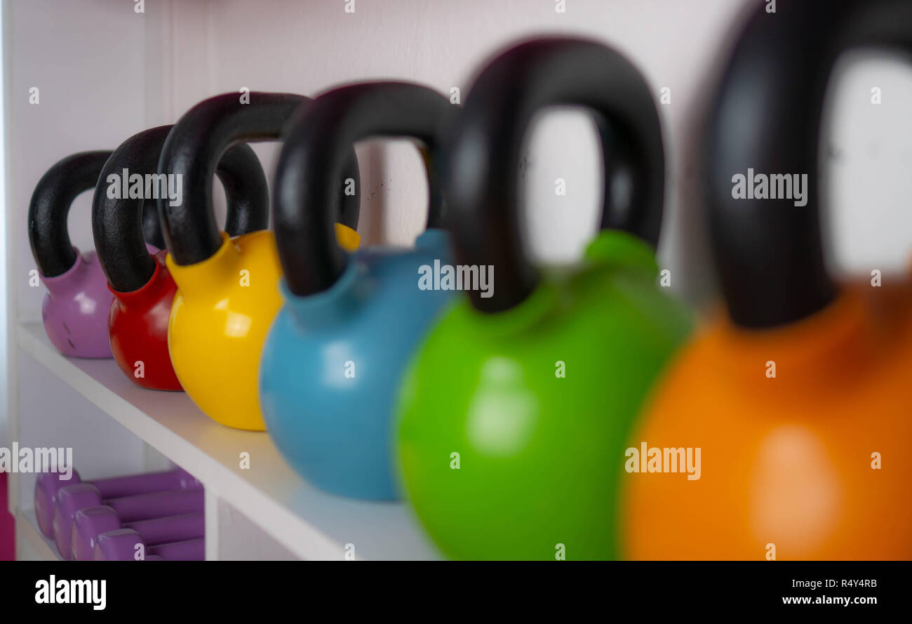 multi-colored weights in the female fitness center. kettlebells are on ...