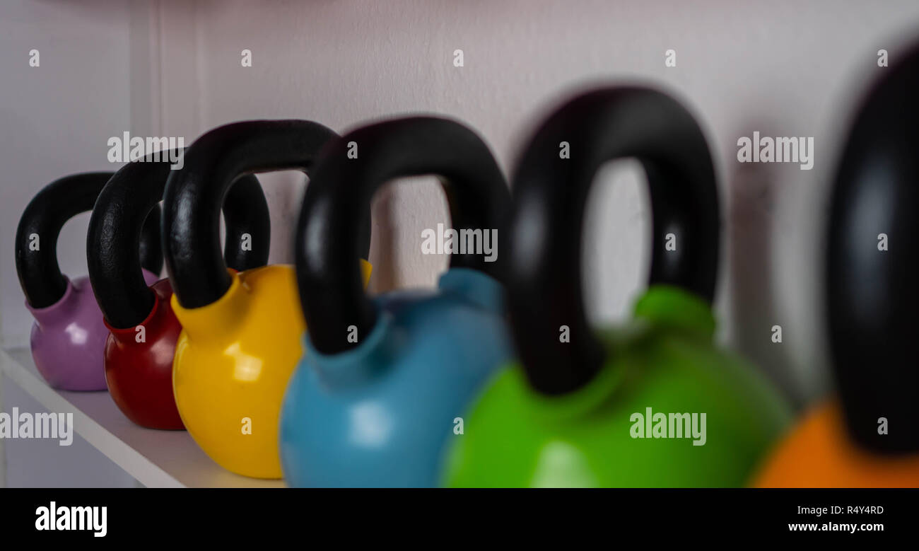 multi-colored weights in the female fitness center. kettlebells are on ...