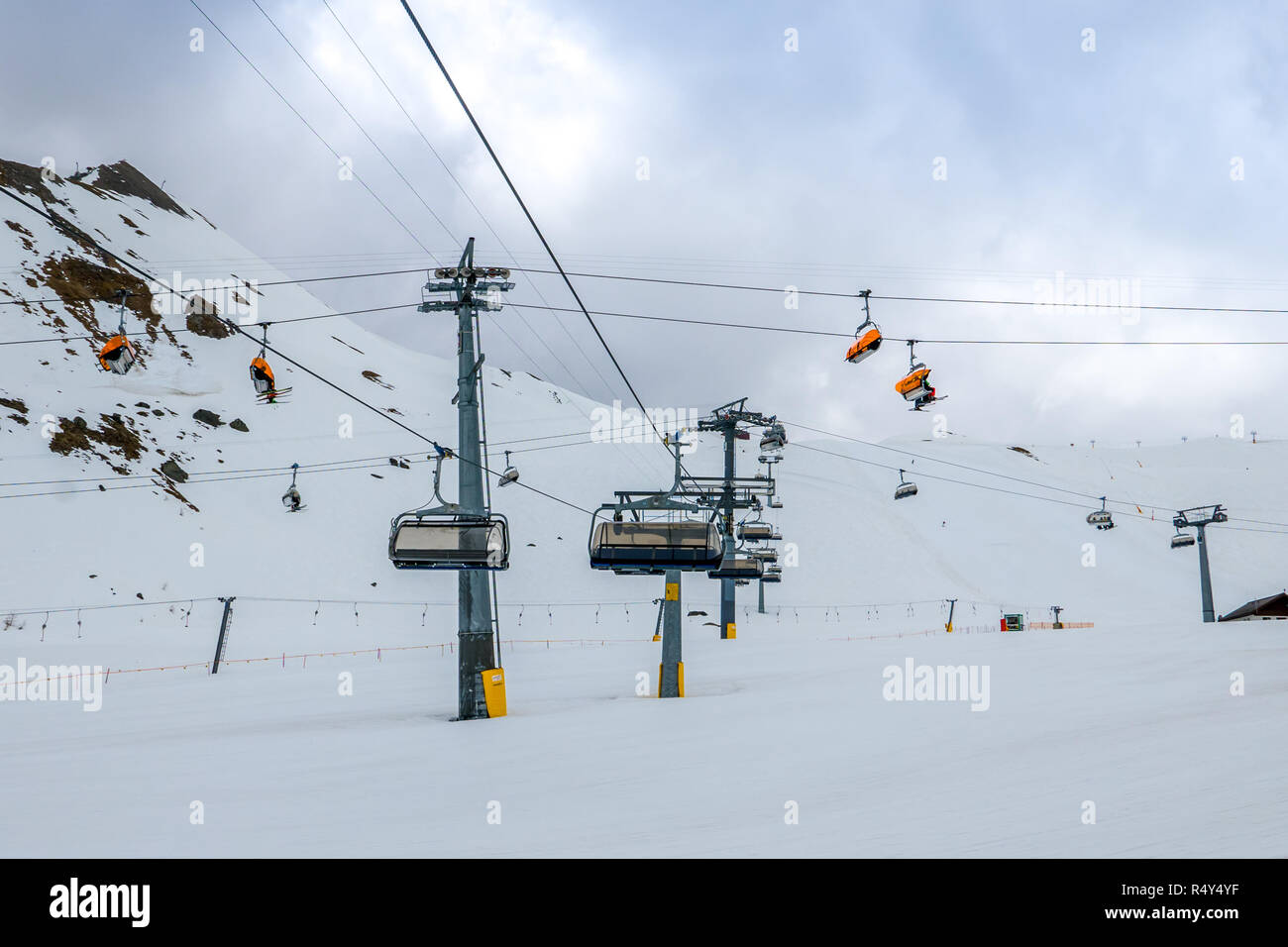 Multiple levels of chairlifts operating in ski resort Stock Photo - Alamy