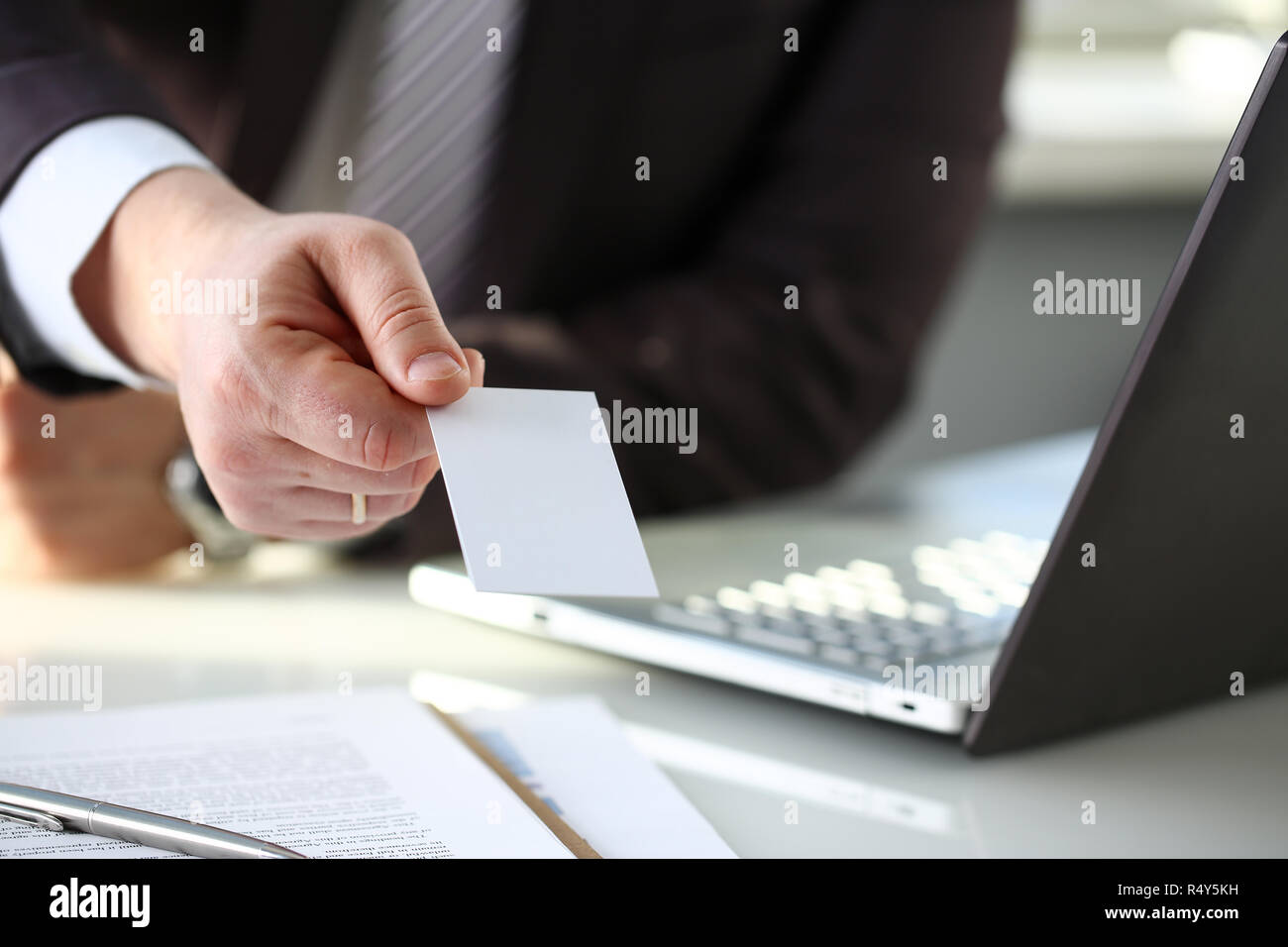 Male arm in suit give blank calling card Stock Photo - Alamy