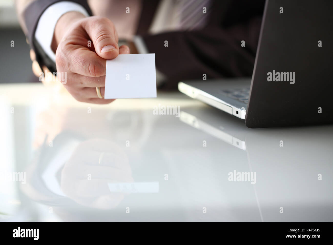 Male arm in suit give blank calling card Stock Photo - Alamy