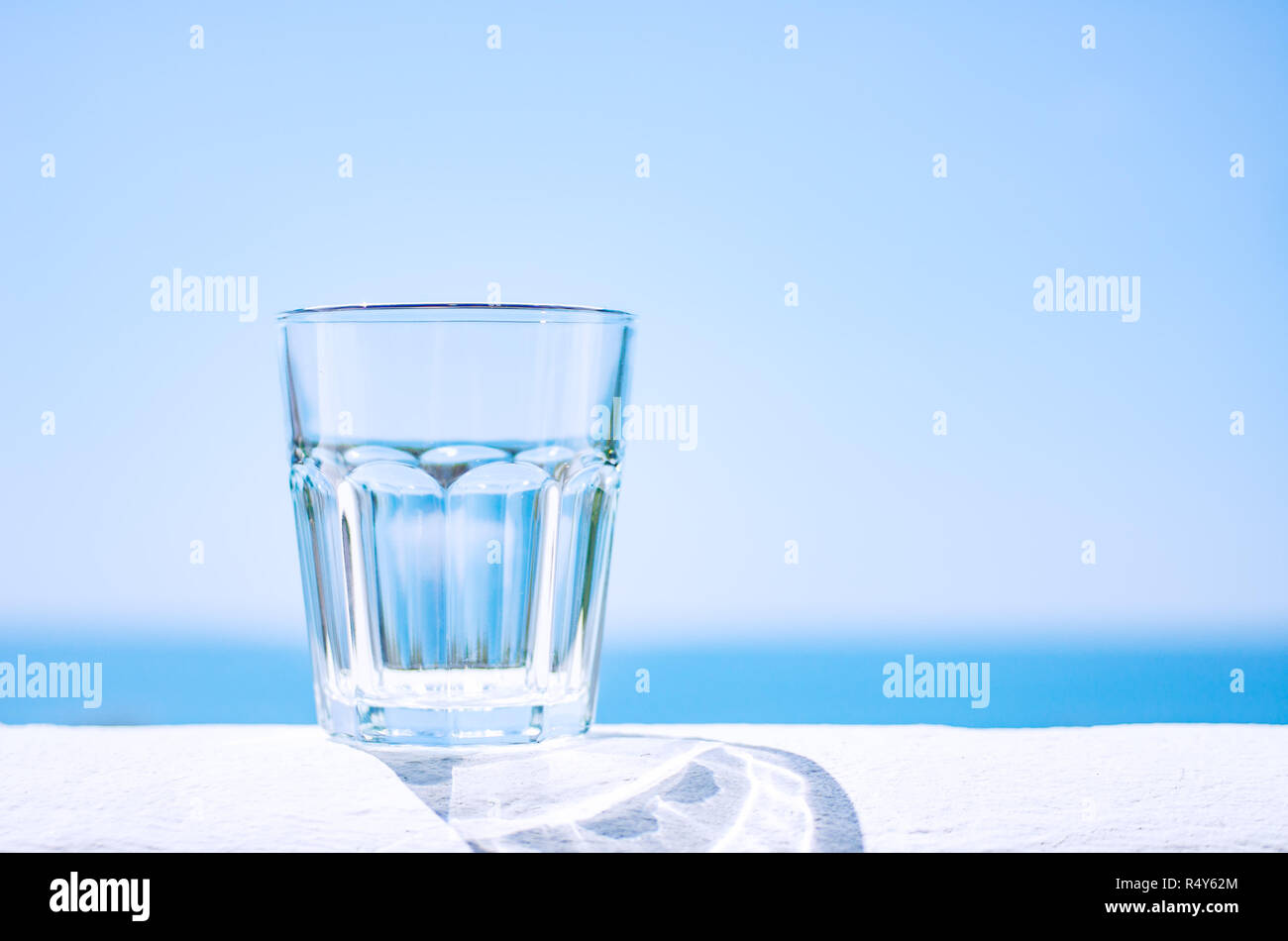Empty glass cup on the background of the sea. Rest on the sea Stock ...