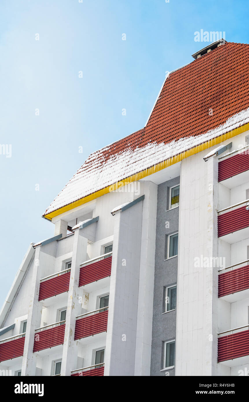 The facade of a modern building architectural background. Pitched roof ...