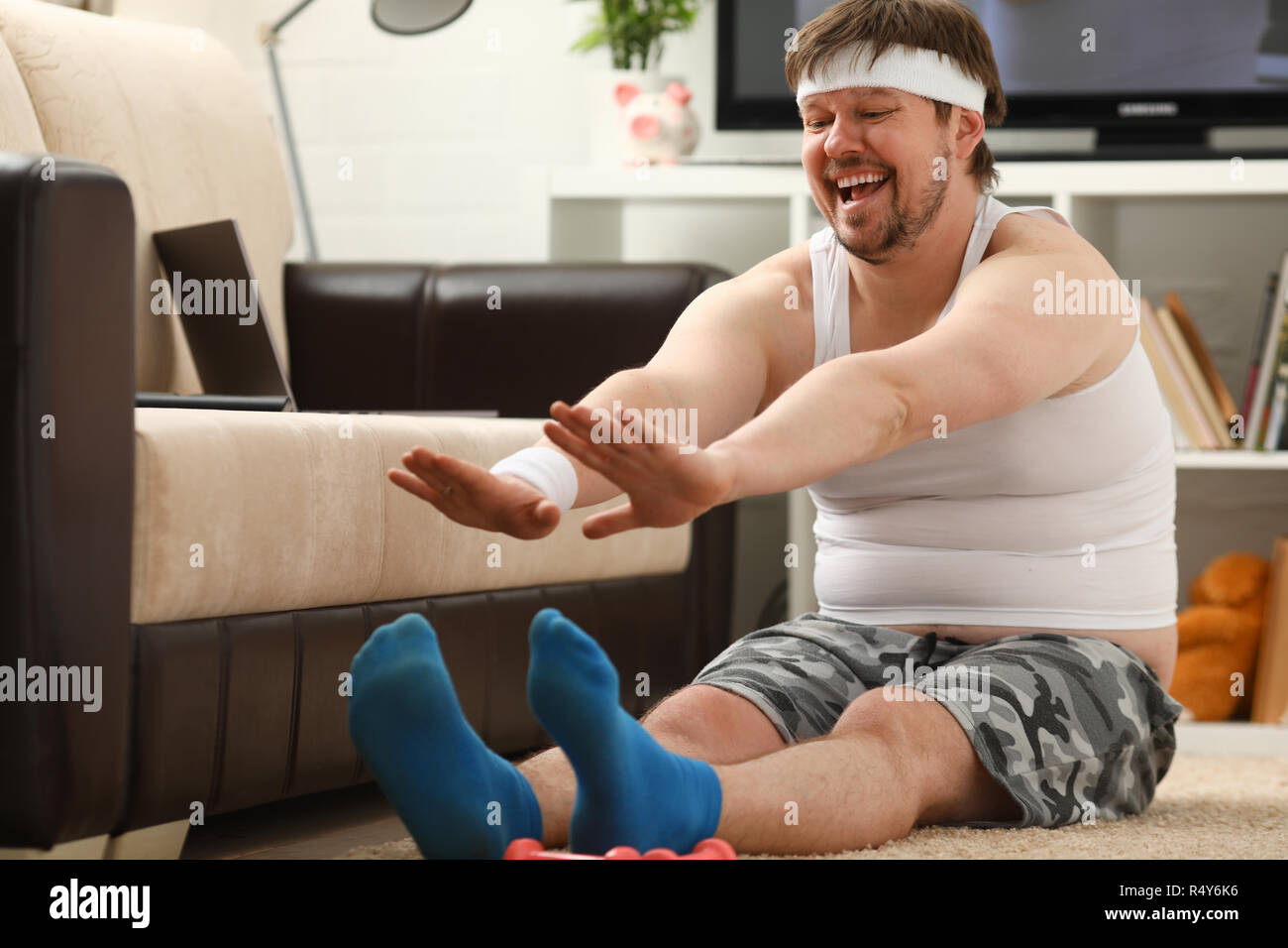 Young attractive fitness man lies on a fat mat with Stock Photo - Alamy