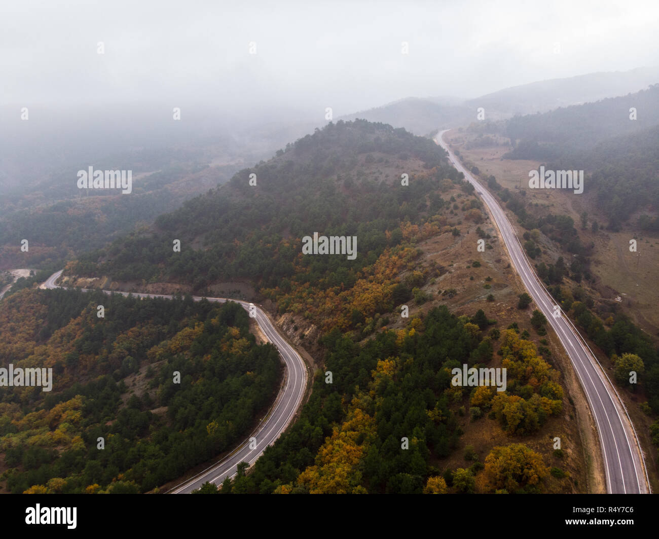 Mountain road inside forest Stock Photo - Alamy