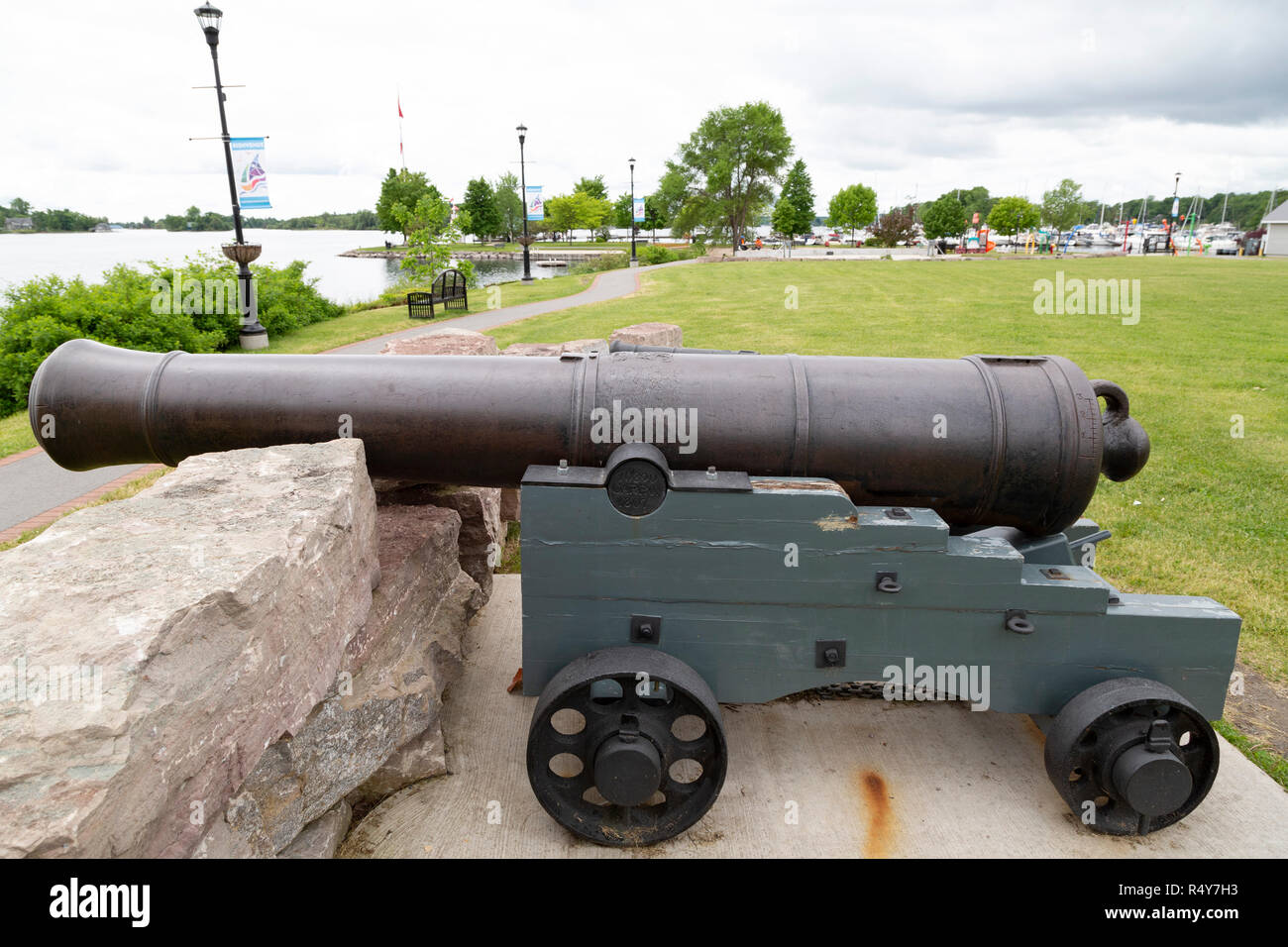 A Georgian era cannon at Gananoque in Ontario, Canada. The town is seen ...