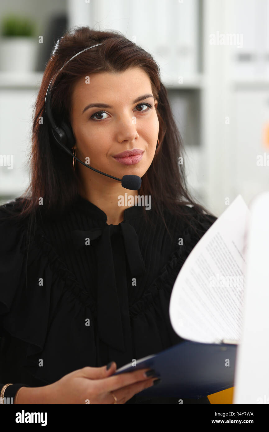 Three call centre service operators at work Stock Photo - Alamy