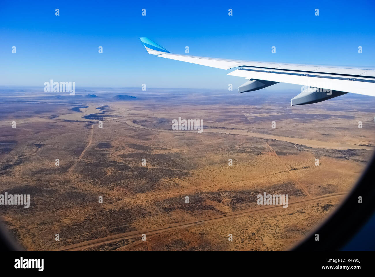 View through the window of a passenger plane flying above Namibia ...