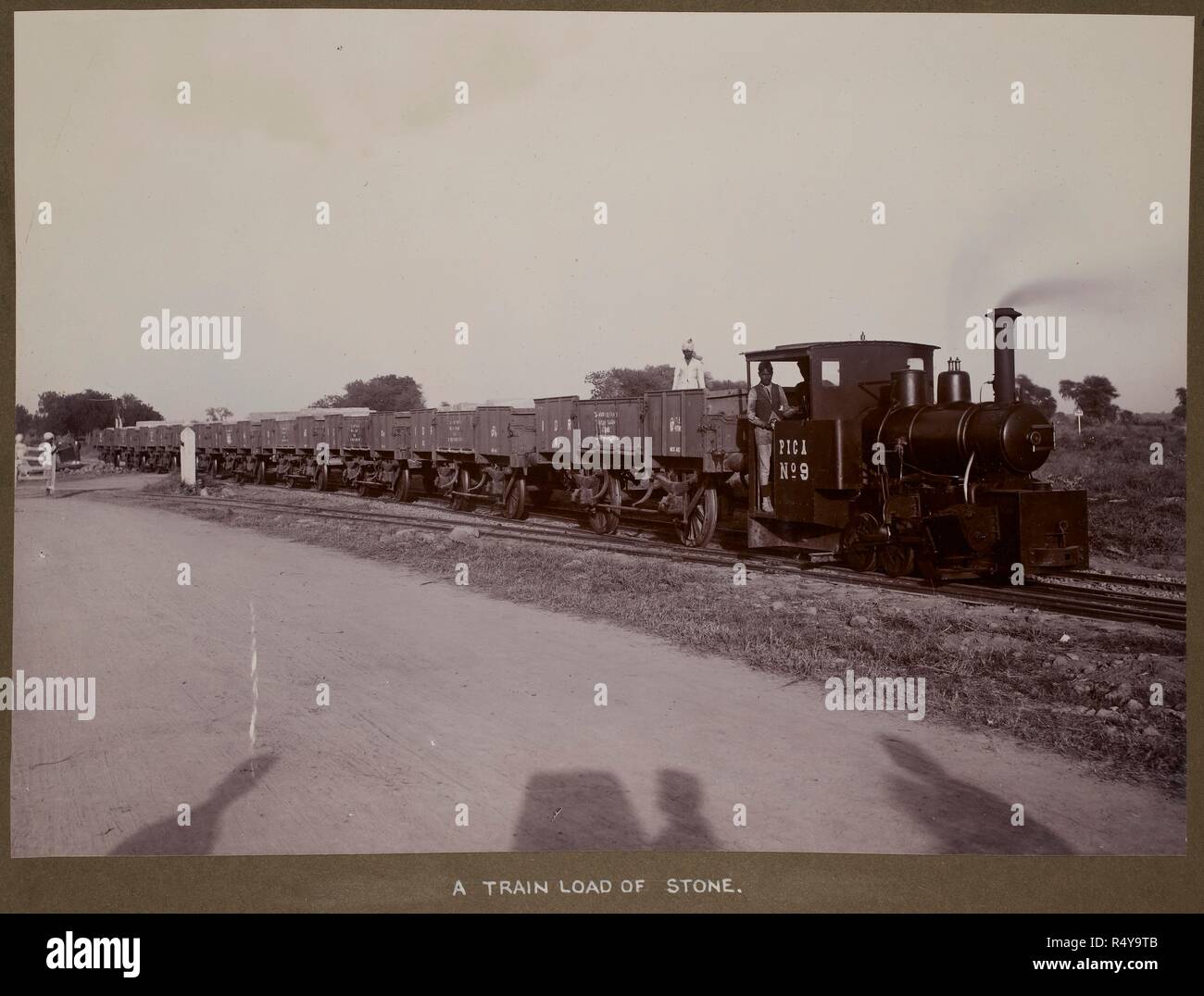 A train load of stone [New Delhi]. A freight train transporting stone ...