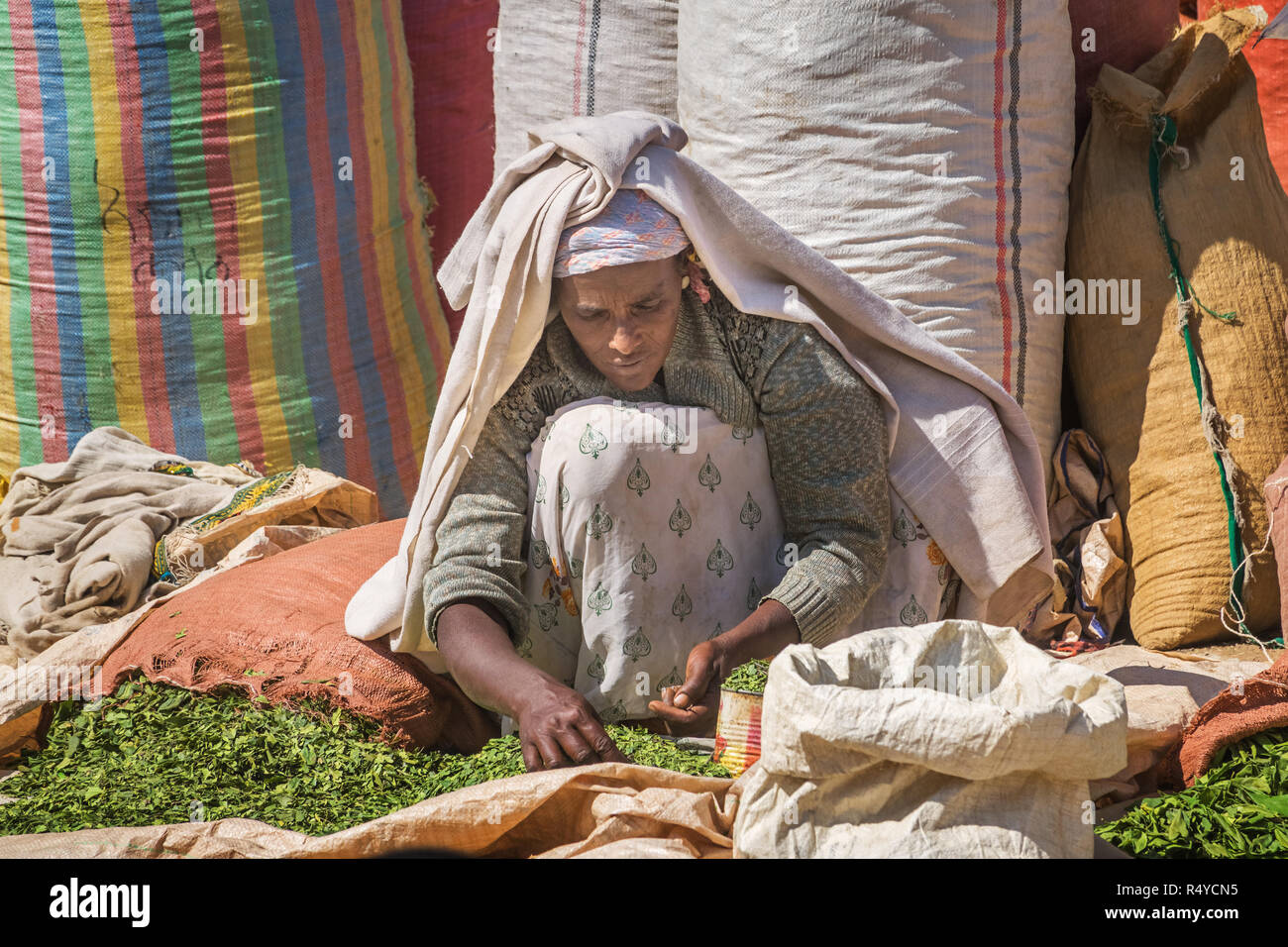 Woman sells produce at the public market in the town of Hawzen, Tigray ...