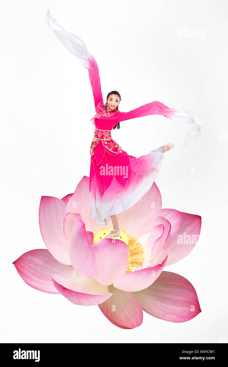 Dancing on the lotus flower woman Stock Photo - Alamy