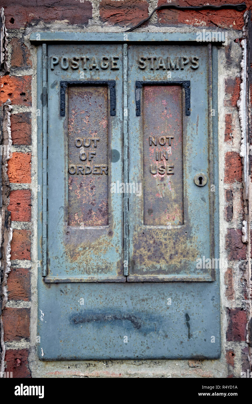 Old disused postage stamps machine Stock Photo - Alamy