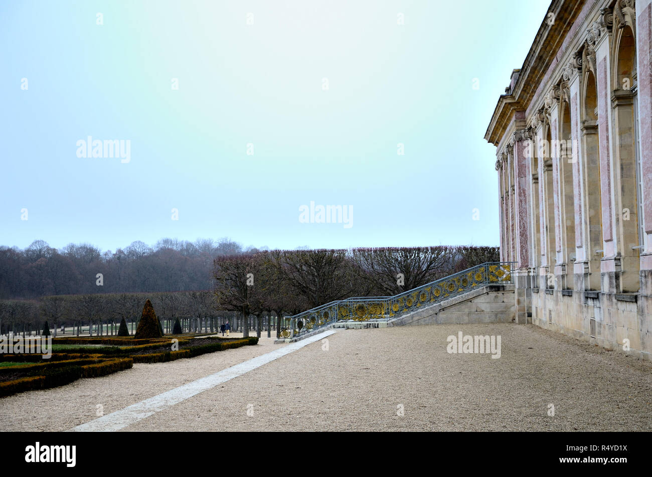 Palace of Versailles. Gliding and blue stairs, palace with columns ...