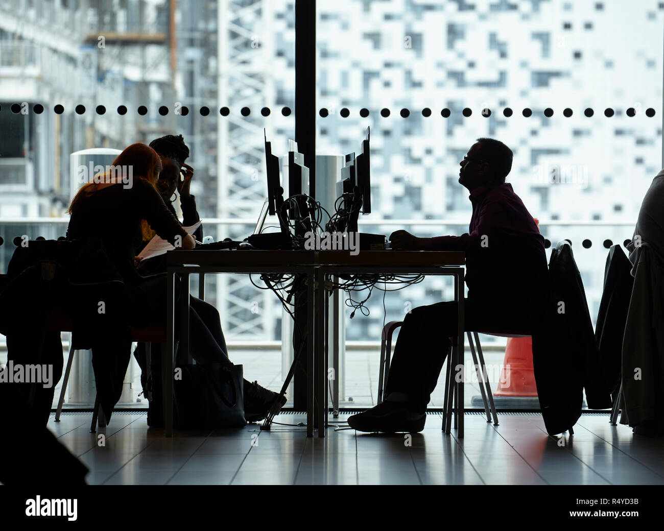 Silhouette of Students studying on Computers at the Birmingham Library ...