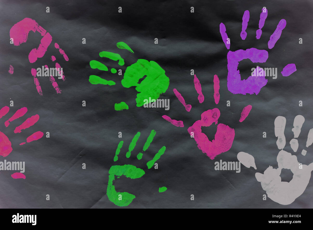 Color prints of kid's hands on a white sheet Stock Photo - Alamy