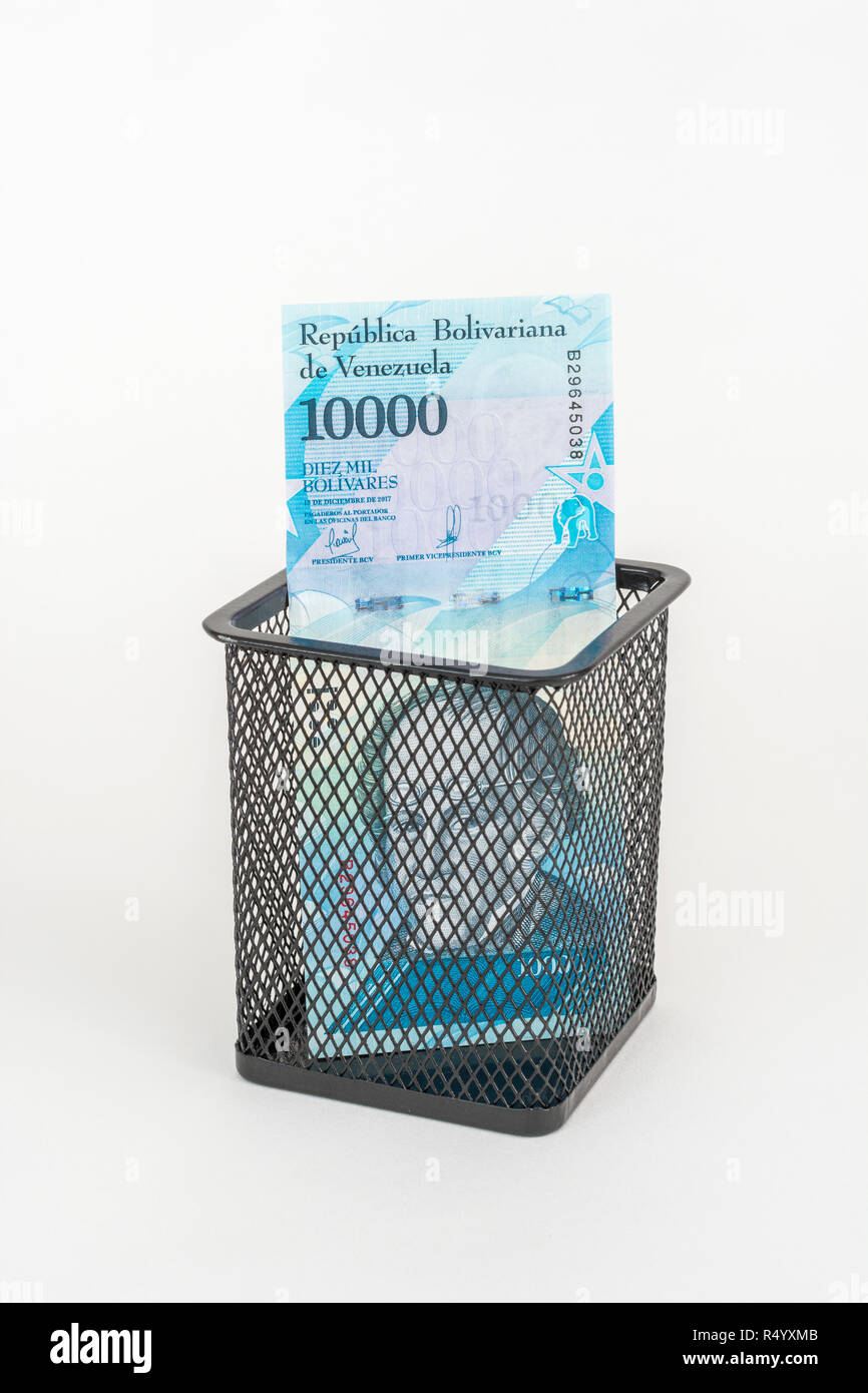 Hyperinflation - Venezuelan 10,000 Bolivares banknote in mini waste ...