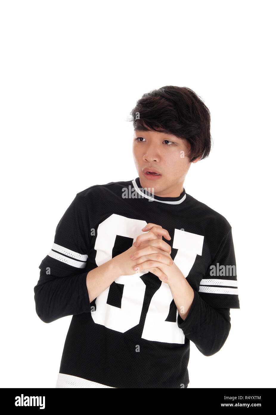 Young Asian man scared looking Stock Photo - Alamy