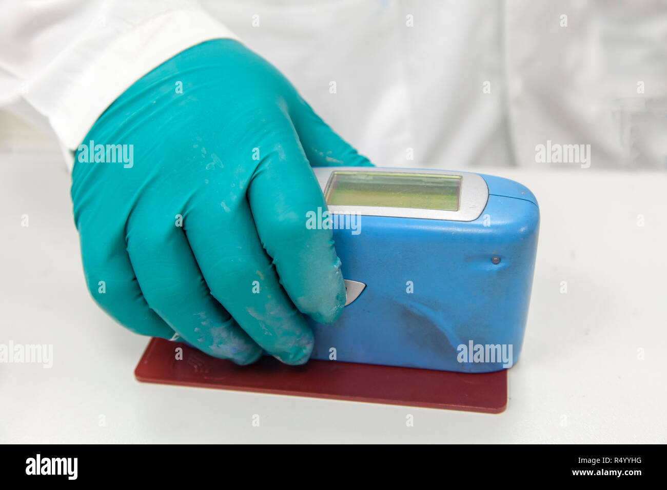 Measuring the gloss of a paint film by gloss meter Stock Photo - Alamy