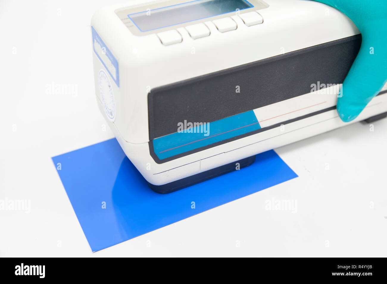 Technician measuring color space by a color spectrophotometer Stock ...