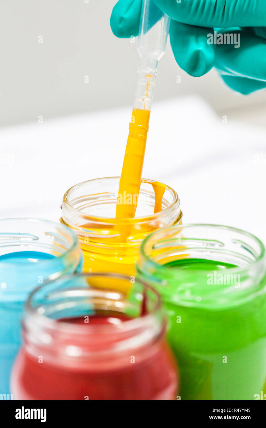 Laboratory technician checking samples from paint Stock Photo - Alamy