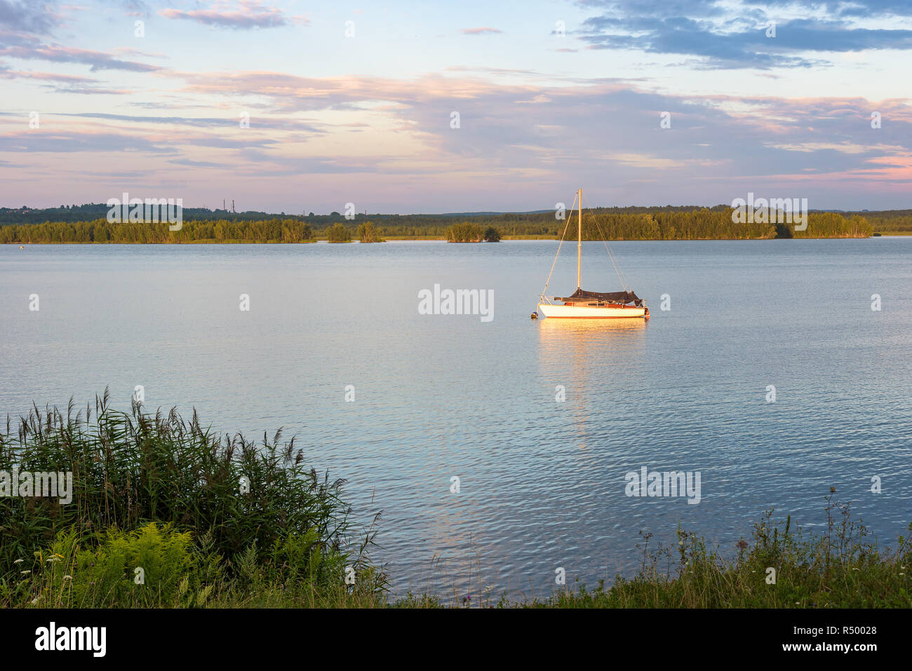 Yacht on the Pogoria IV lake at sunset, Dabrowa Gornicza, Poland Stock ...