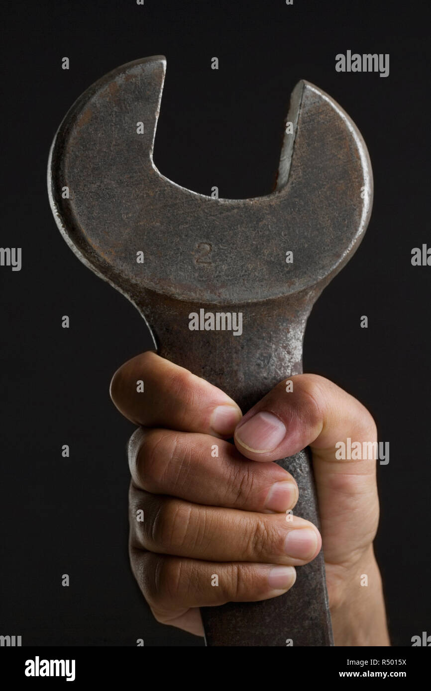 Hand clutching wrench hi-res stock photography and images - Alamy
