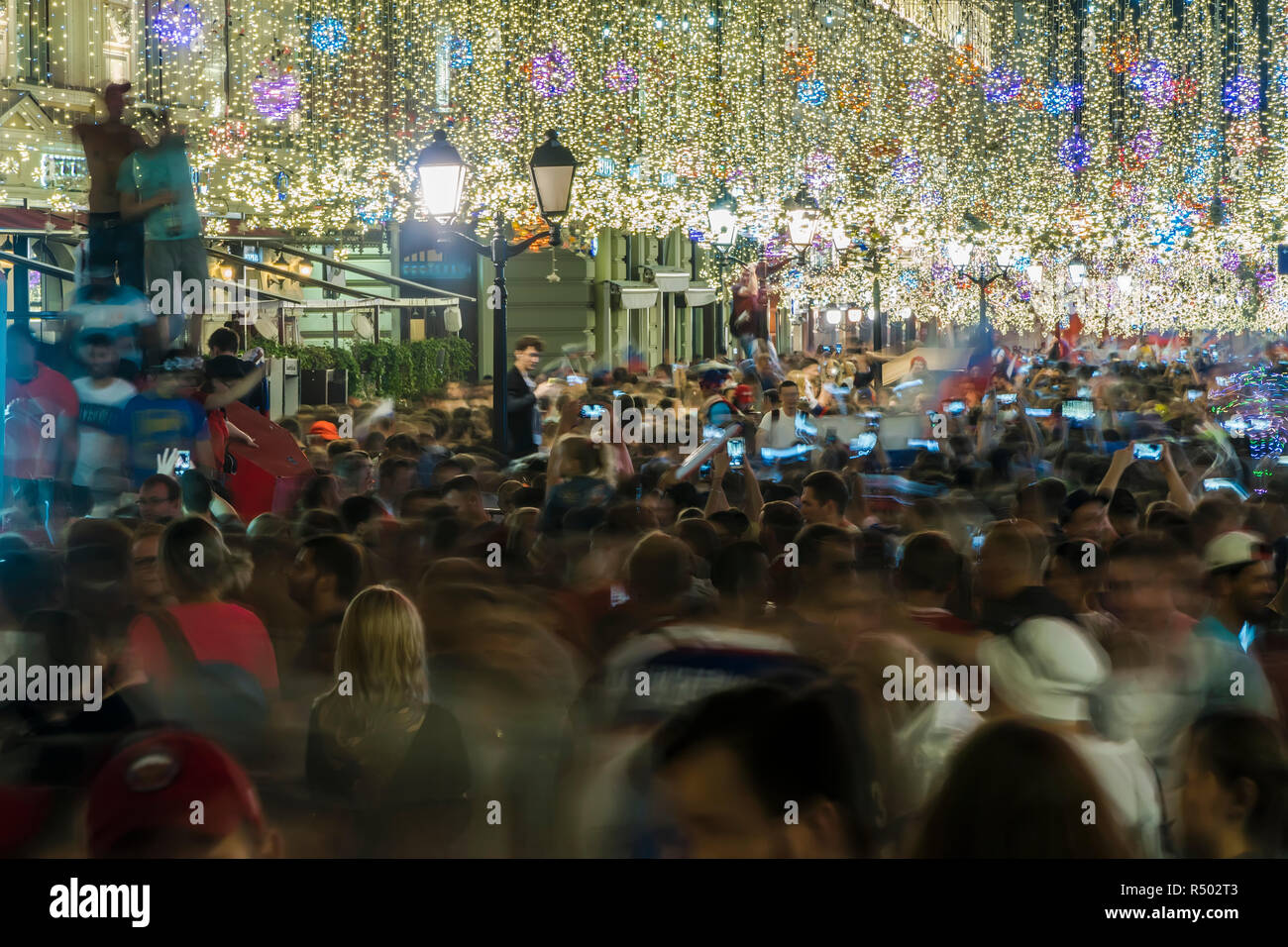 Football fans and spectators have fun on the streets after the game, in ...