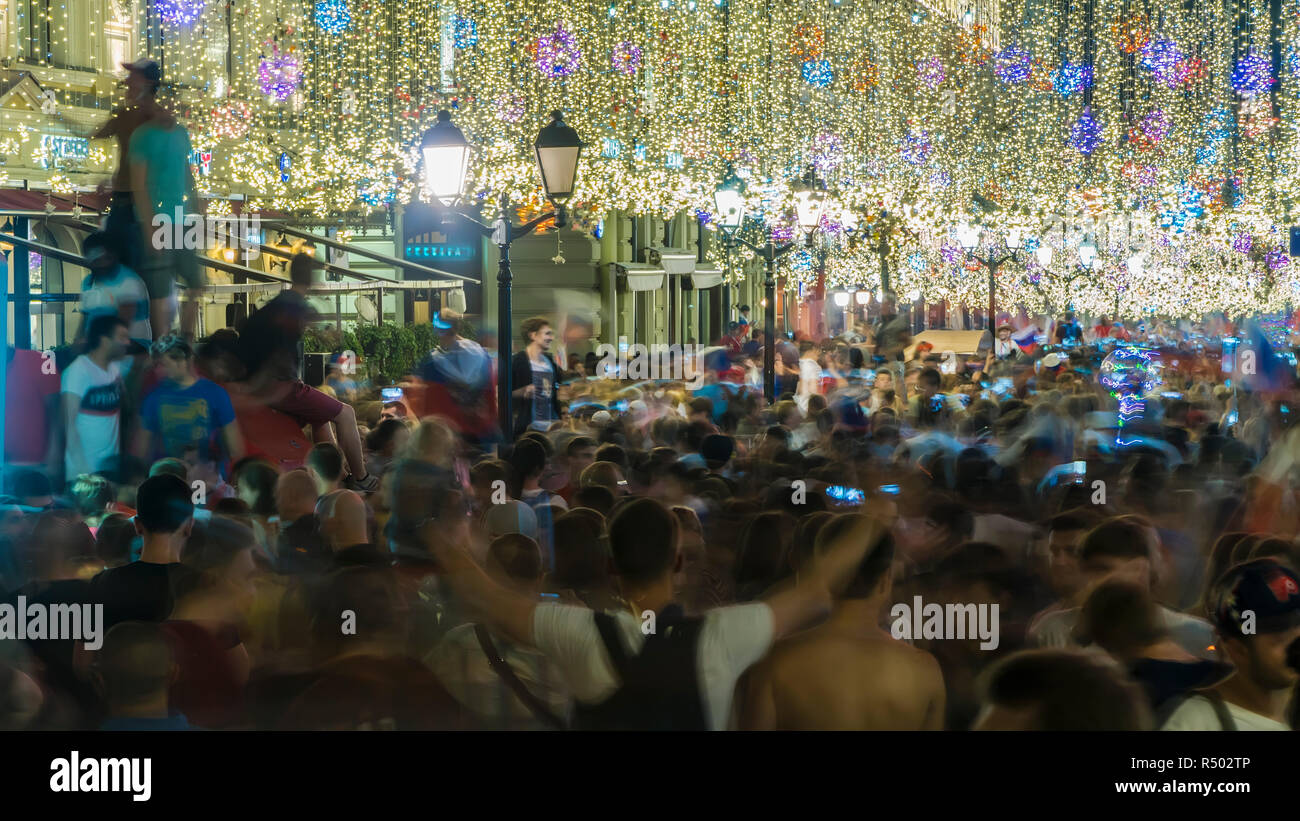 Football fans and spectators have fun on the streets after the game, in ...
