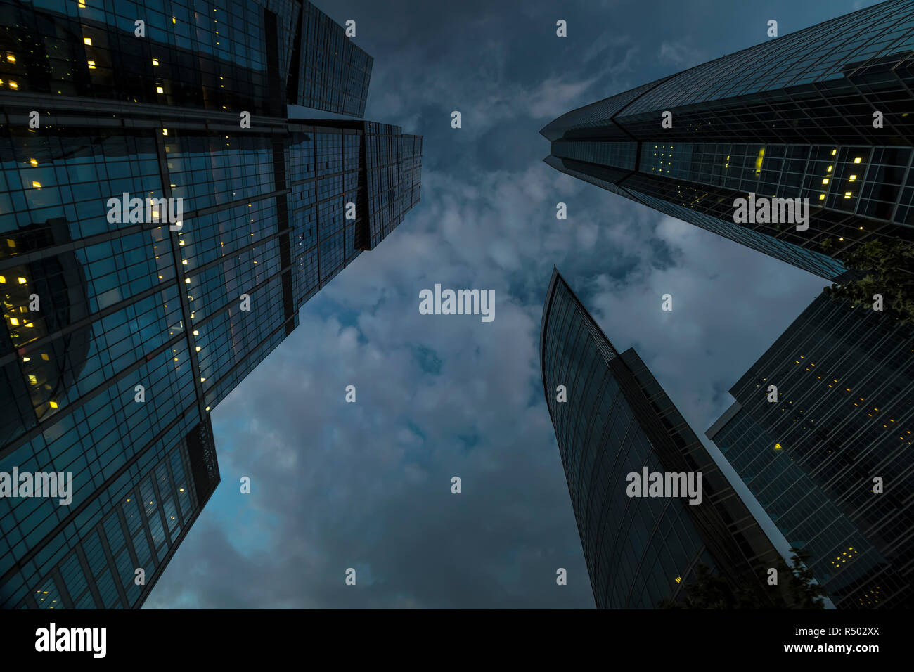 bottom-up view of skyscrapers and flying clouds Stock Photo - Alamy