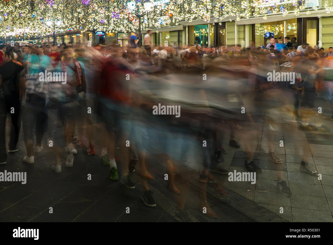 Football fans and spectators have fun on the streets after the game, in ...