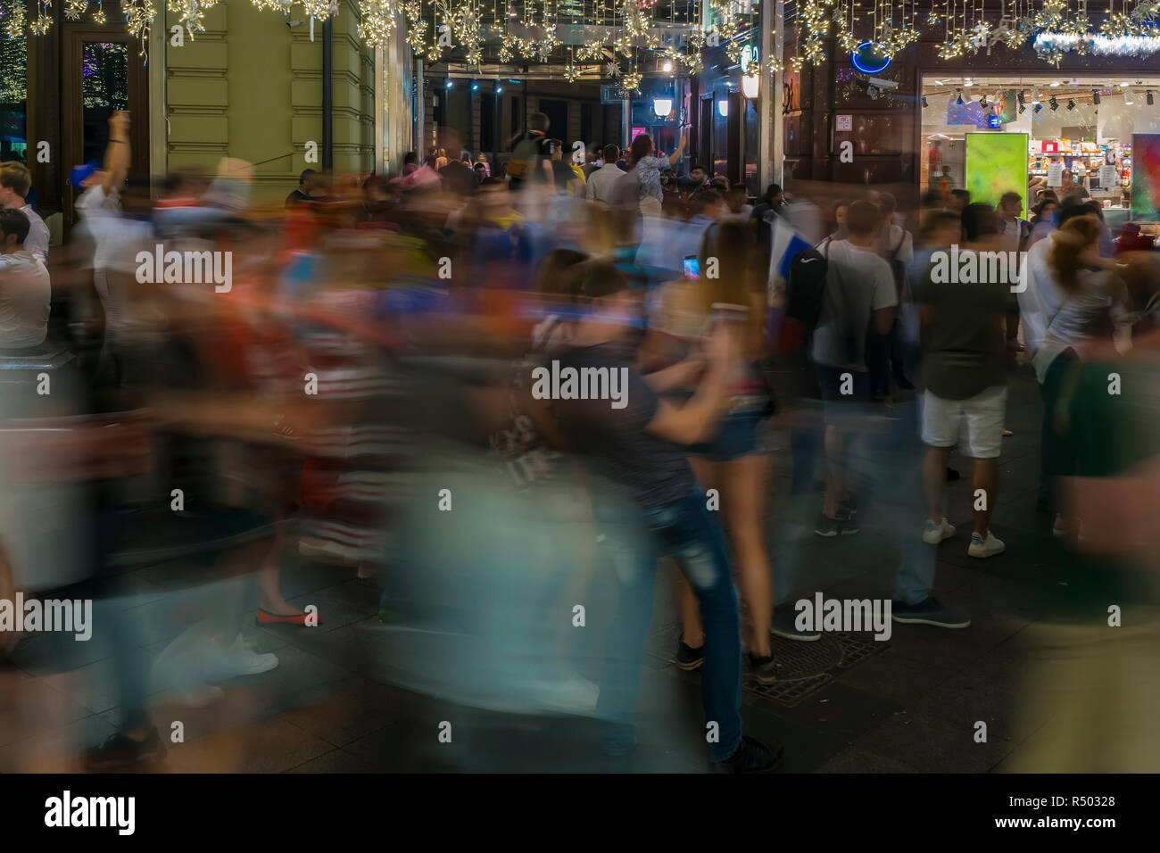 Football fans and spectators have fun on the streets after the game, in ...