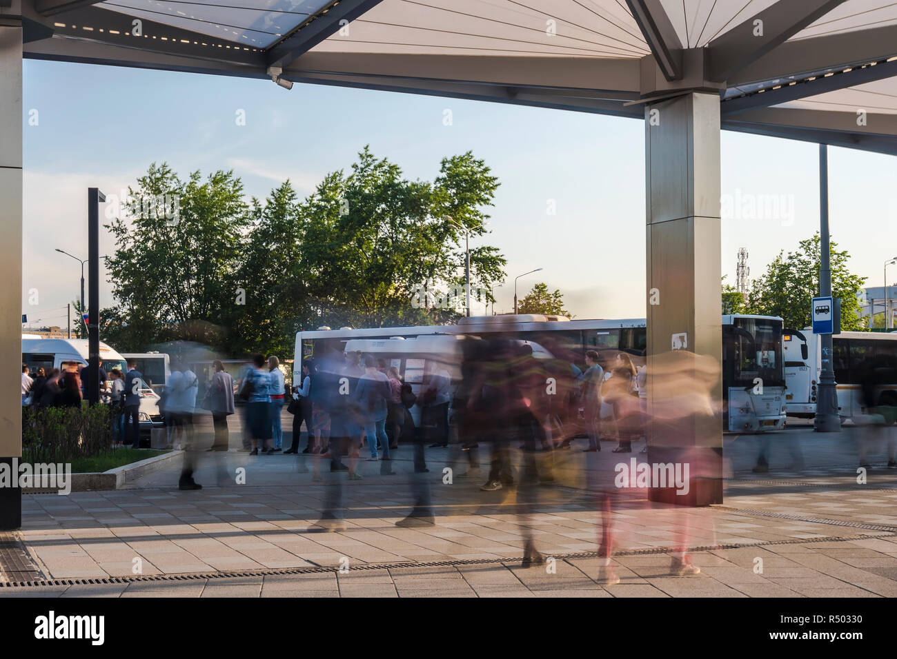 passengers waiting and boarding buses at the bus terminal Stock Photo ...