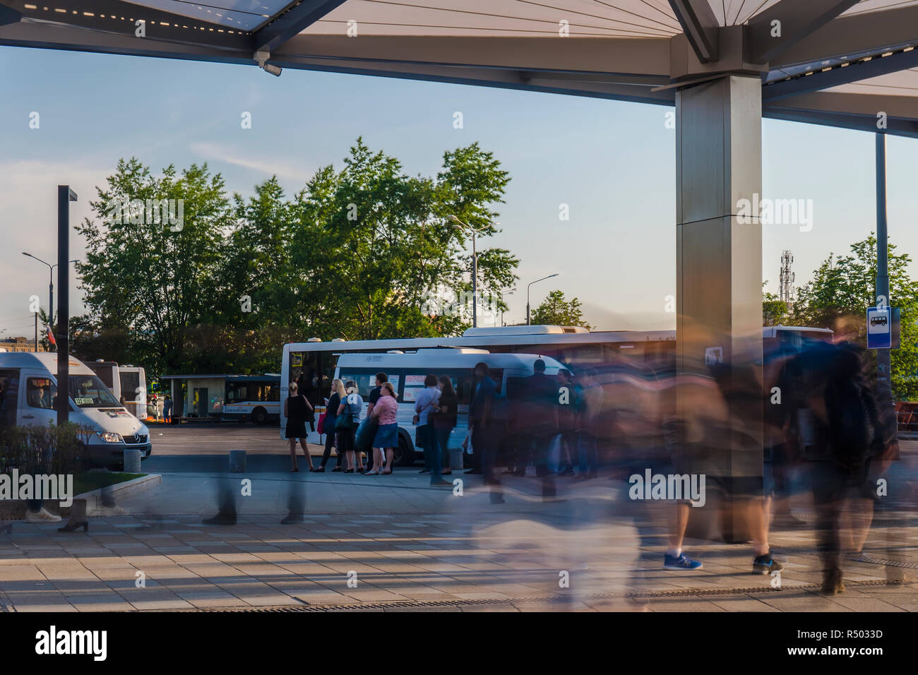 passengers waiting and boarding buses at the bus terminal Stock Photo ...
