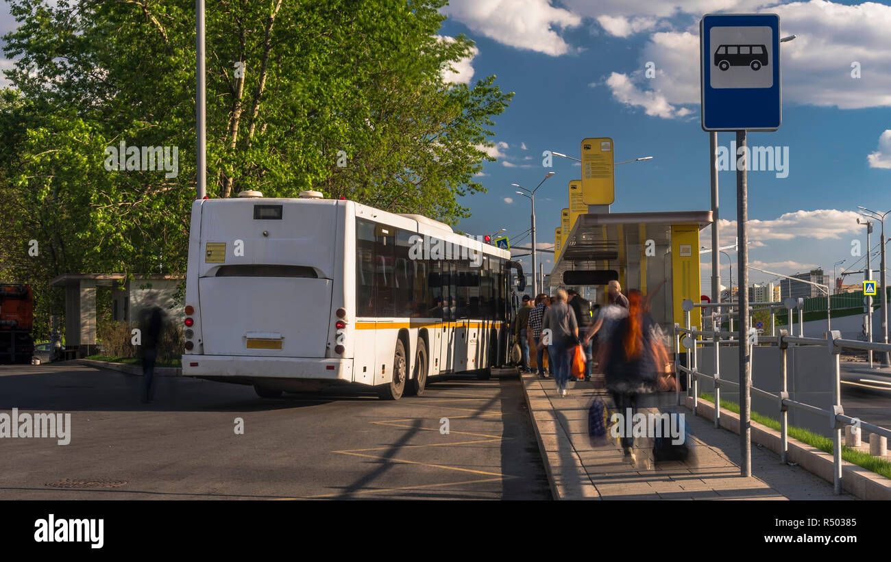 passengers waiting and boarding buses at the bus terminal Stock Photo ...