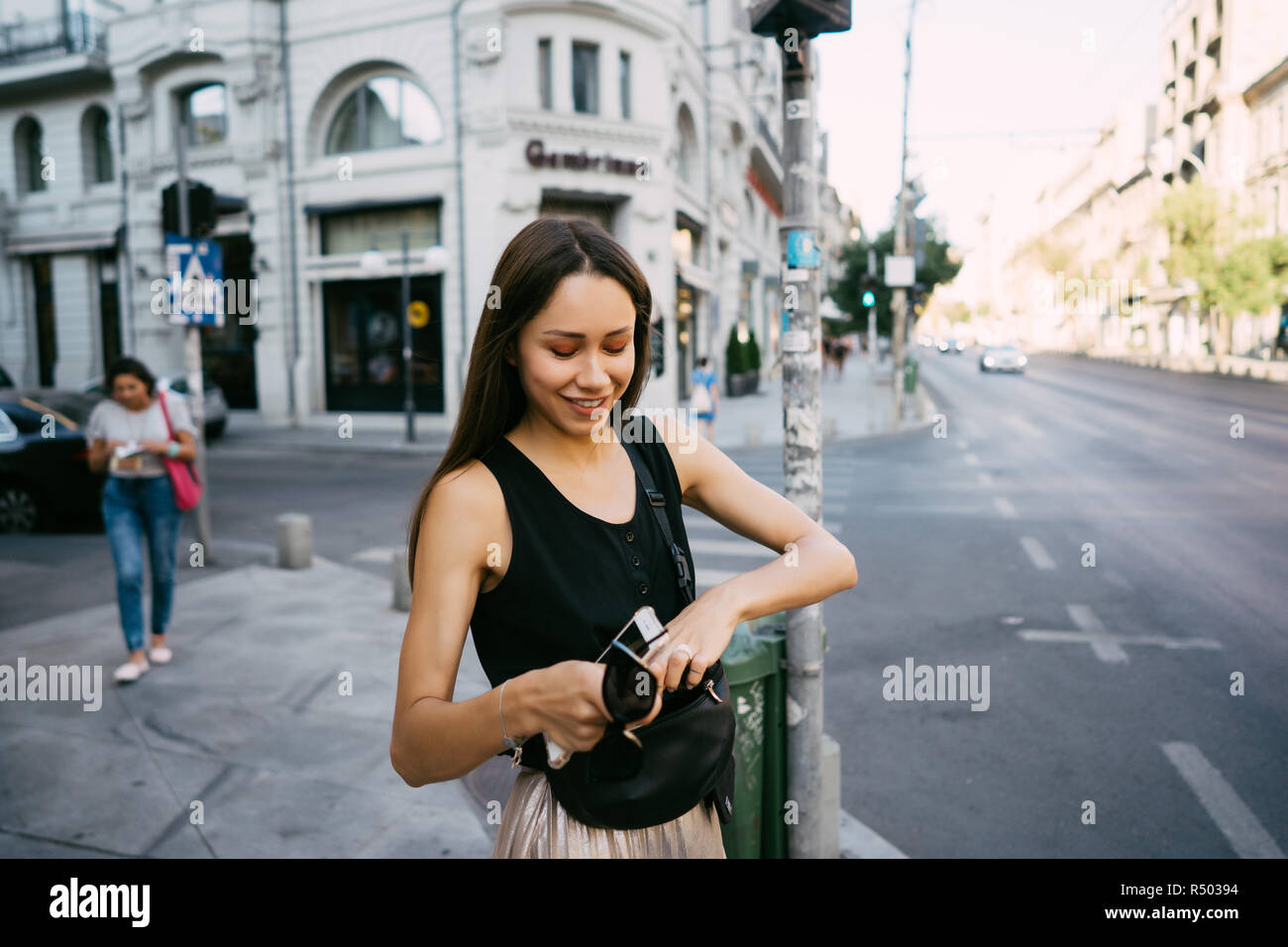 A beautiful young girl is standing at a crossroads Stock Photo - Alamy