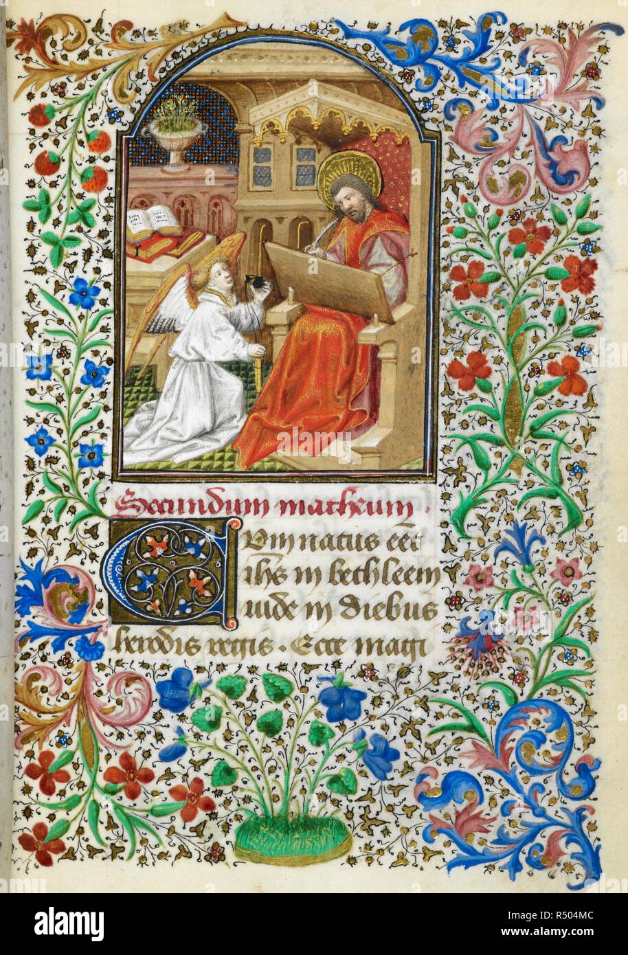 Miniature of Matthew writing at a desk, while his symbol, the angel ...