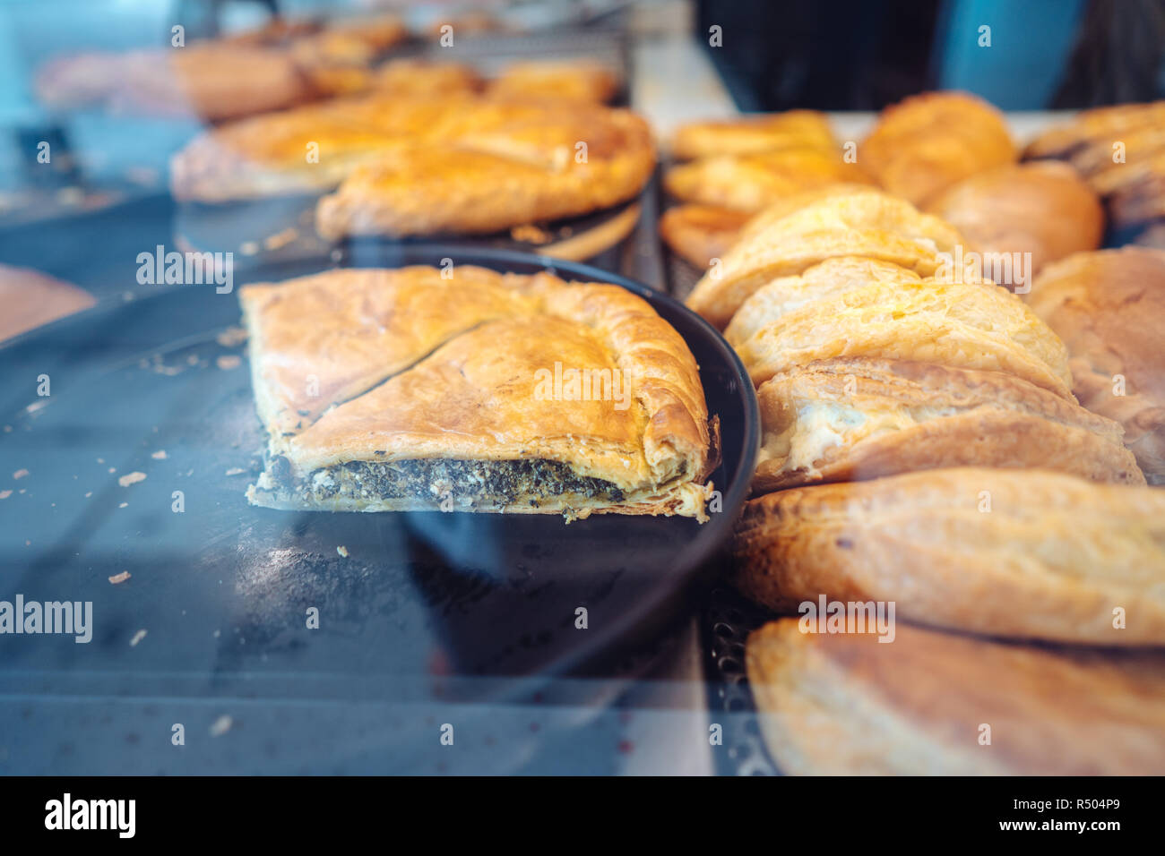 Fresh bakery in showcase of a street shop bakery food Stock Photo - Alamy